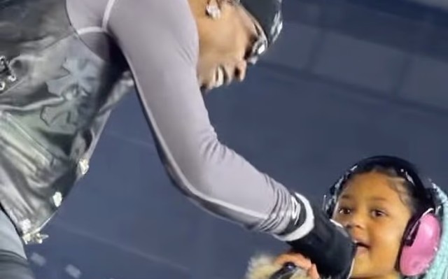 TRAVIS SCOTT BRINGS DAUGHTER STORMI ONSTAGE DURING TOKYO SHOW